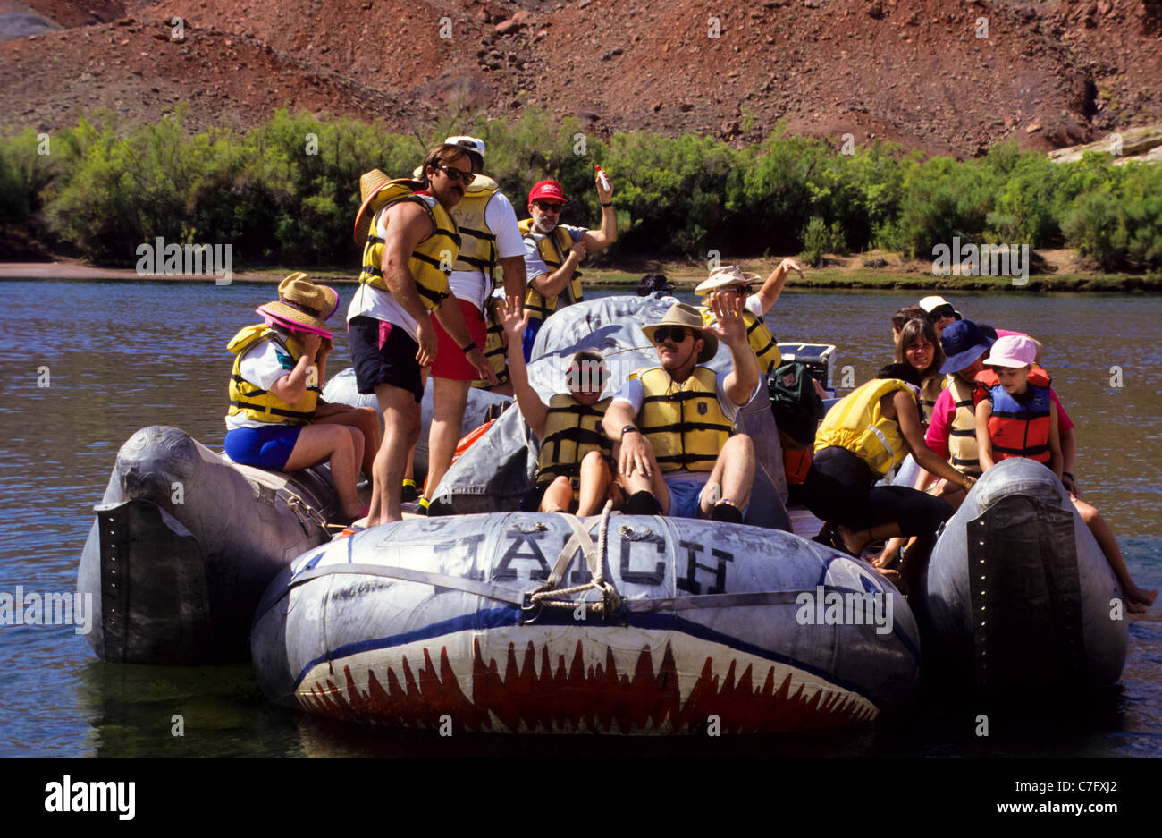 Tourists in rubber raft on the Colorado River at Lees Ferry in Grand ...
