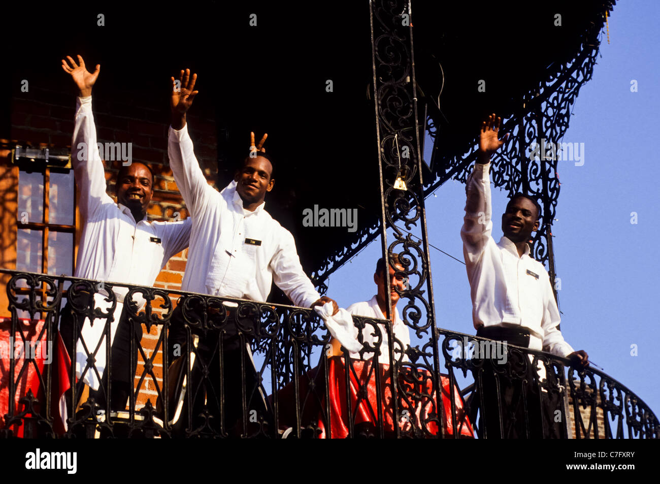 Four black americans waiters waiwing hello on the famous cast iron ...