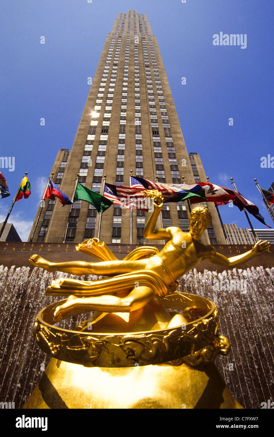 Prometeus golden sculpture at The Rockefeller Center and skyscraper in ...