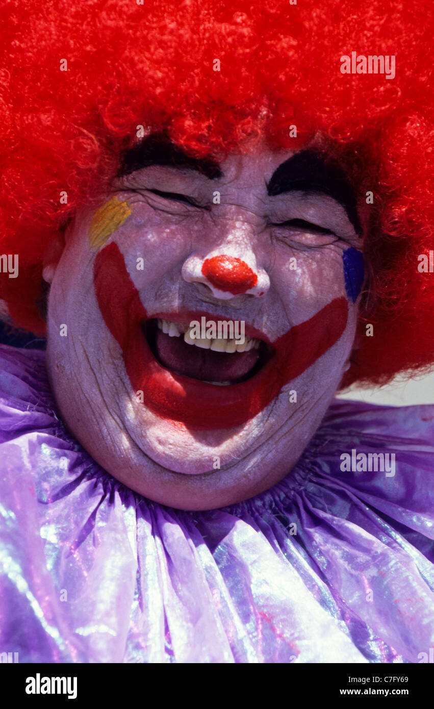 Portrait of a laughing american clown with reed hair Stock Photo - Alamy