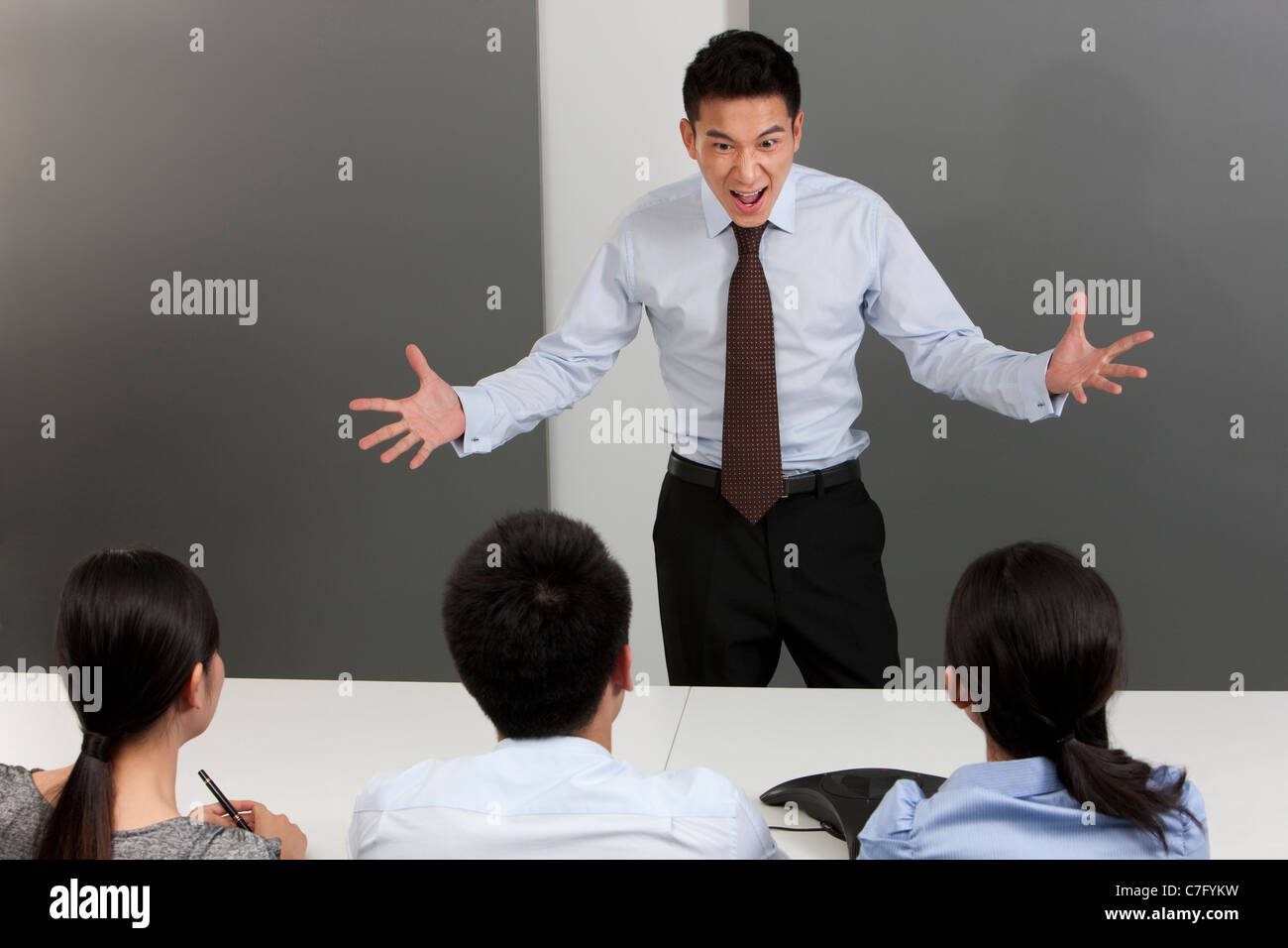 Manager Shouting at Employees Stock Photo - Alamy