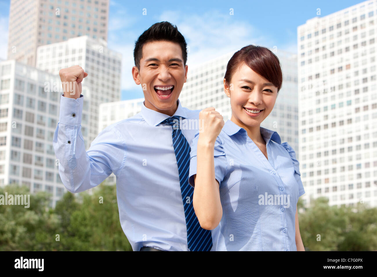 Colleagues Standing Cheering Together Stock Photo - Alamy