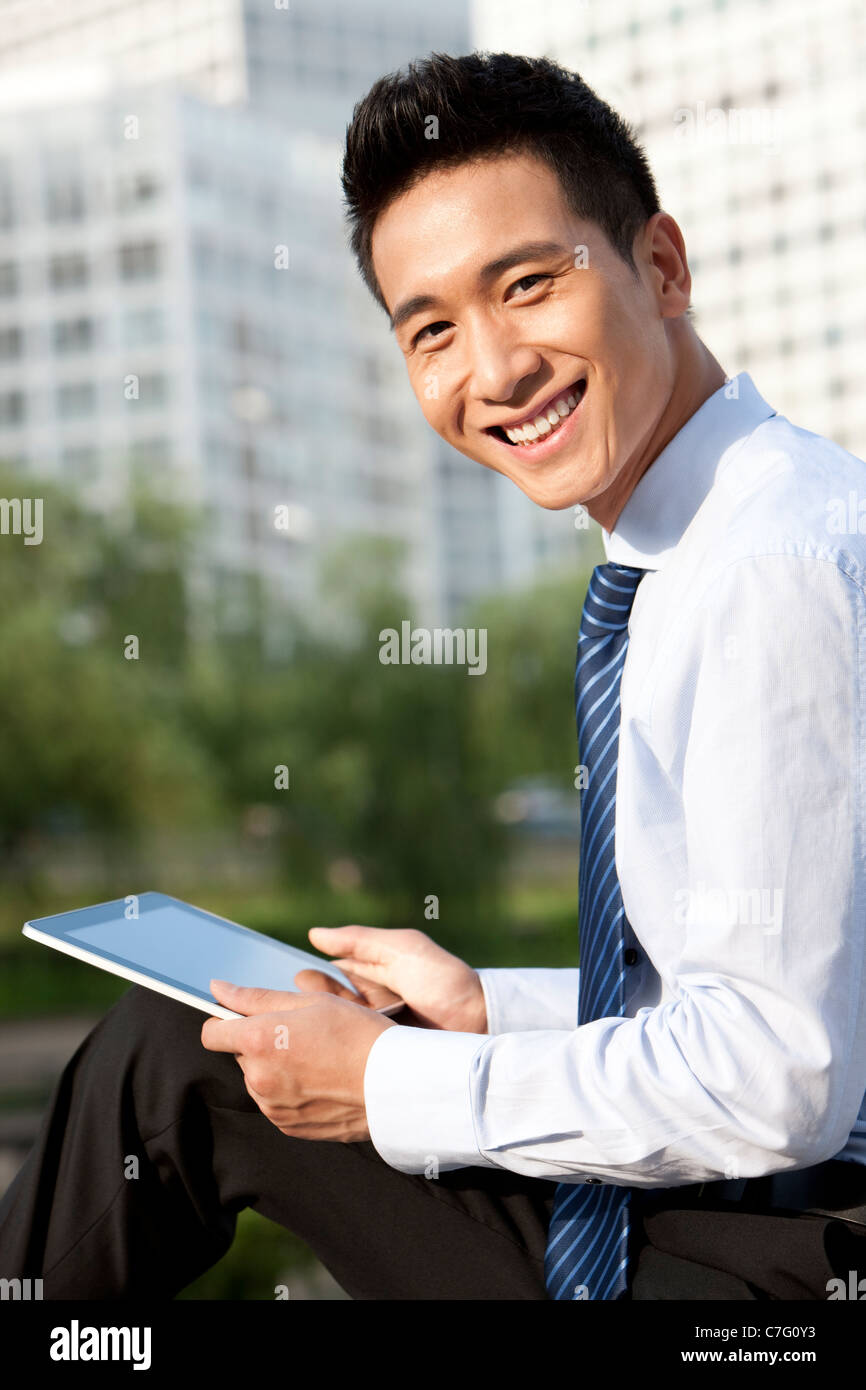 Businessman Using a Tablet Stock Photo - Alamy