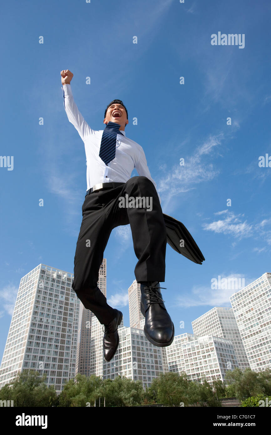 Man expressing success jumping on hi-res stock photography and images ...