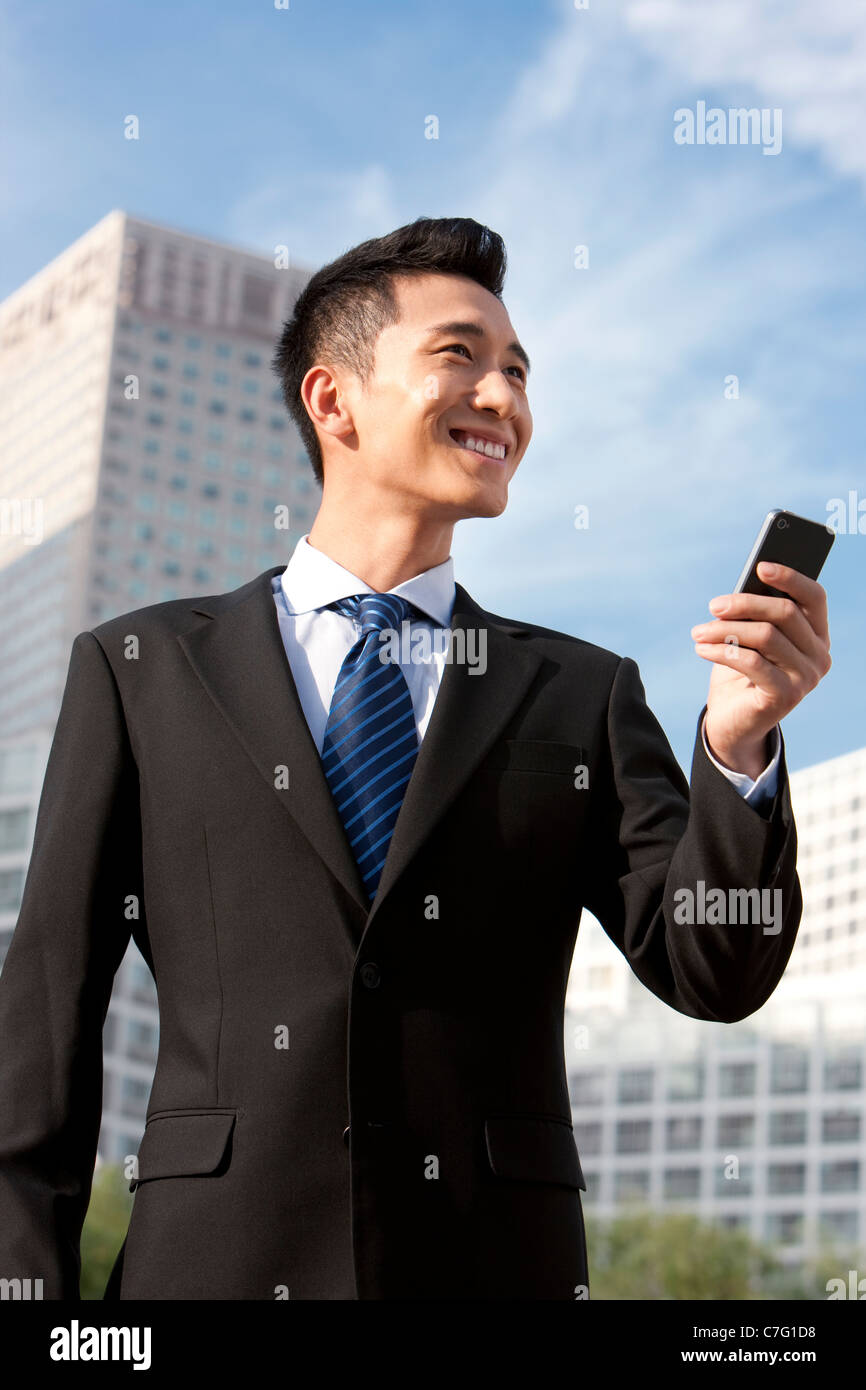 Businessman Using Mobile Phone Stock Photo - Alamy