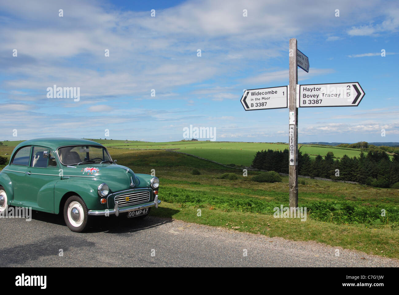 classic Morris Minor touring the Dartmoor countryside overlooking ...