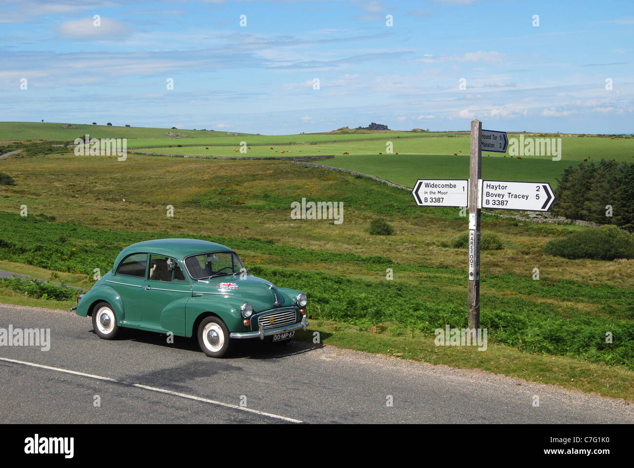 classic Morris Minor touring the Dartmoor countryside overlooking ...