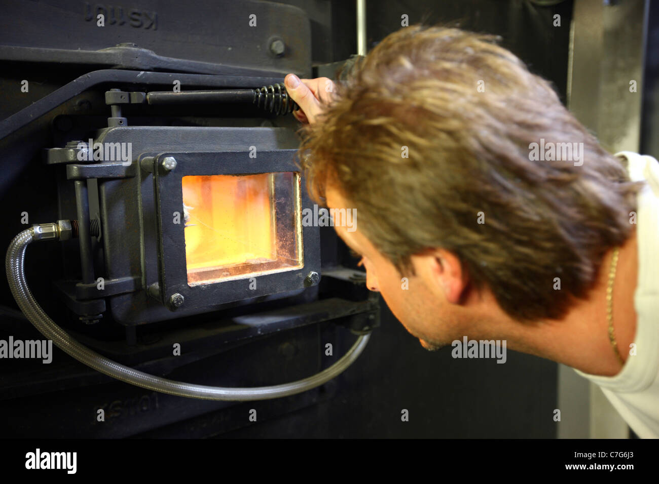 Biomass power plant. Burns waste wood to heat water, for running a ...