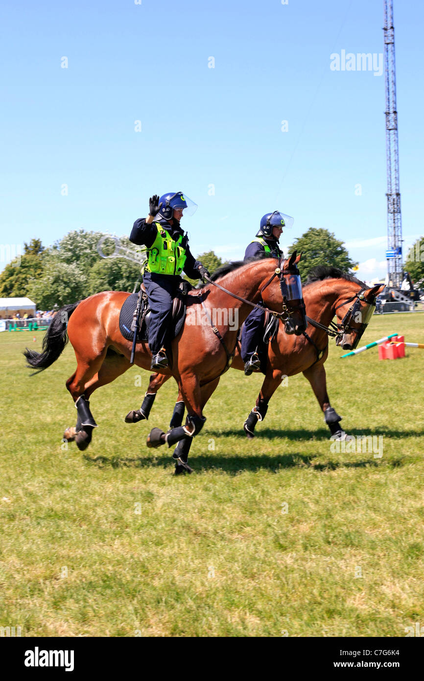 Modern day Police Officers in riot gear on horseback at the Bath & West ...