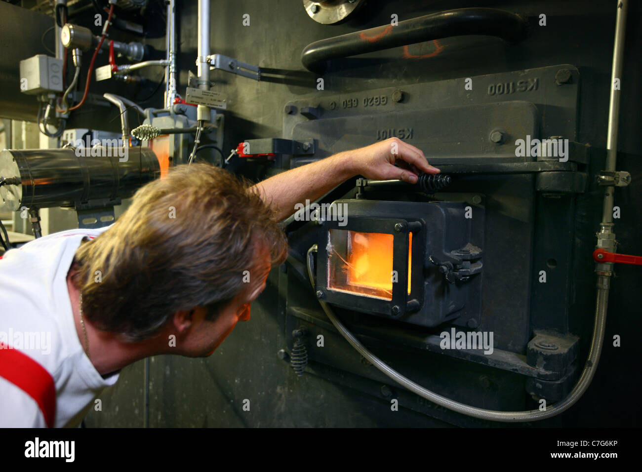 Biomass power plant. Burns waste wood to heat water, for running a ...