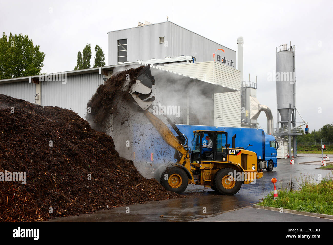 Biomass power plant. Burns waste wood to heat water, for running a ...