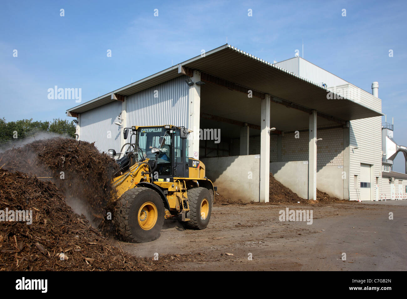 Biomass power plant. Burns waste wood to heat water, for running a ...