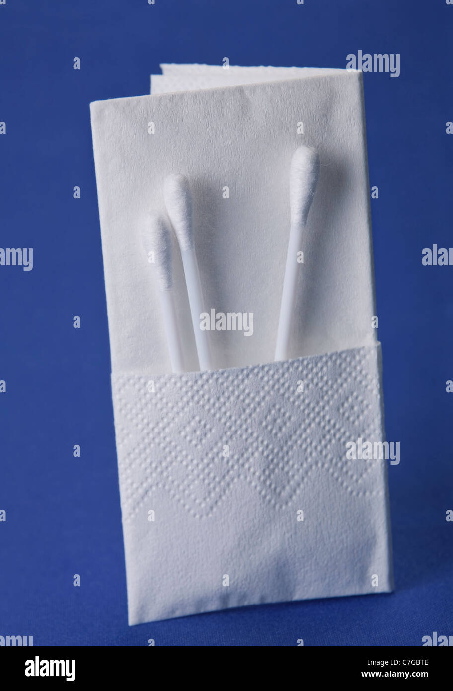 Hygiene paper tissue pile and stick on blue Stock Photo - Alamy