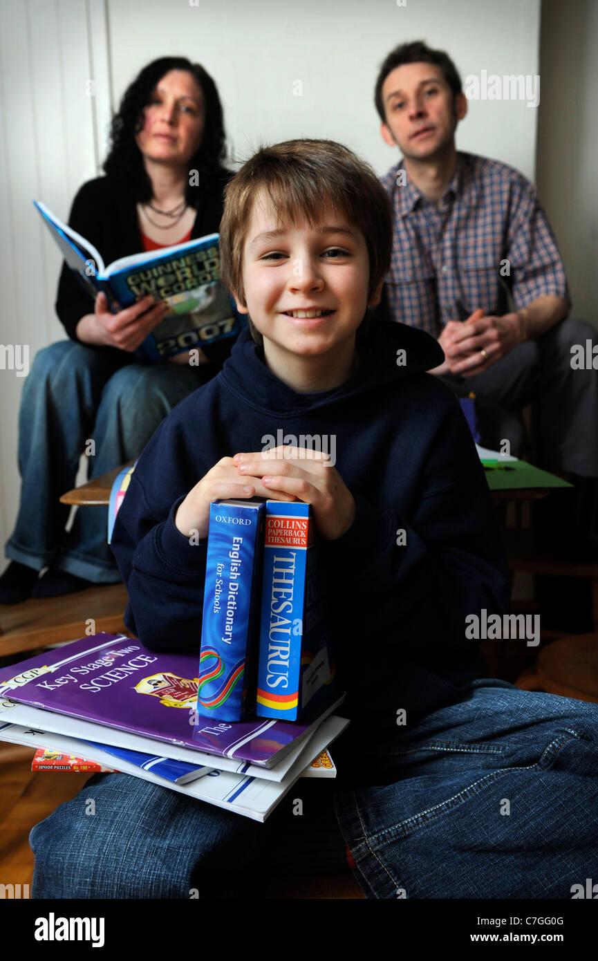 Parents with their child being educated at home UK Stock Photo - Alamy