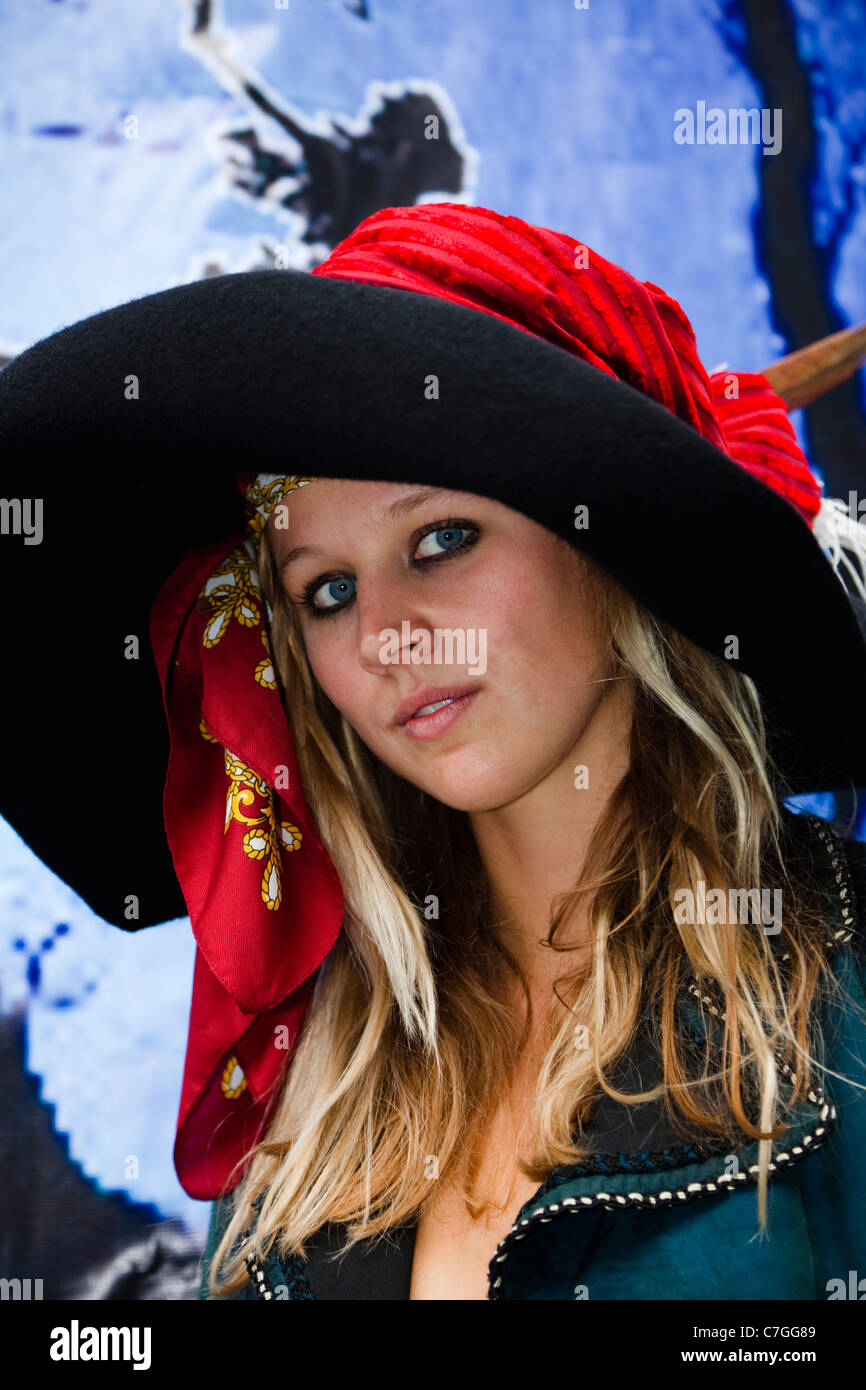 Young female actor dressed as Peter Pan and performing in street ...