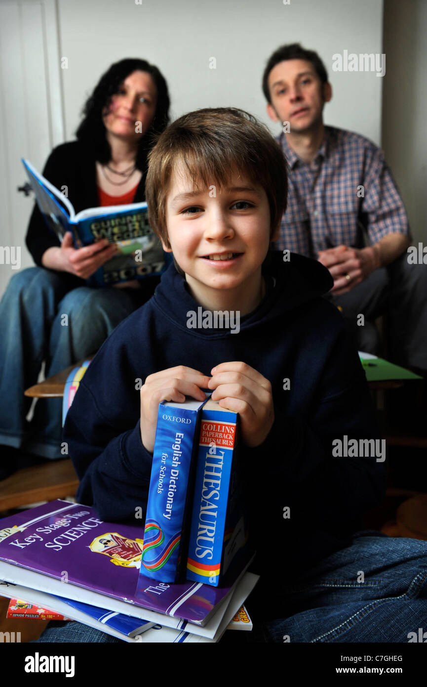 Parents with their child being educated at home UK Stock Photo - Alamy