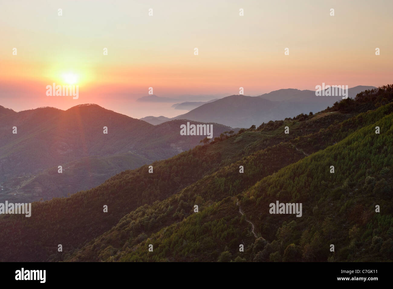 Beautiful sunset over a mountain Stock Photo - Alamy