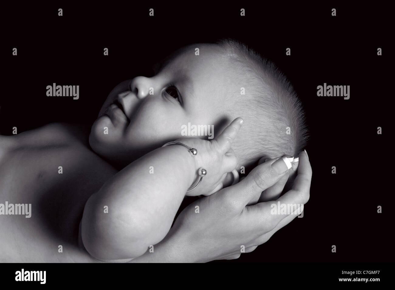 Baby in Arms Stock Photo - Alamy