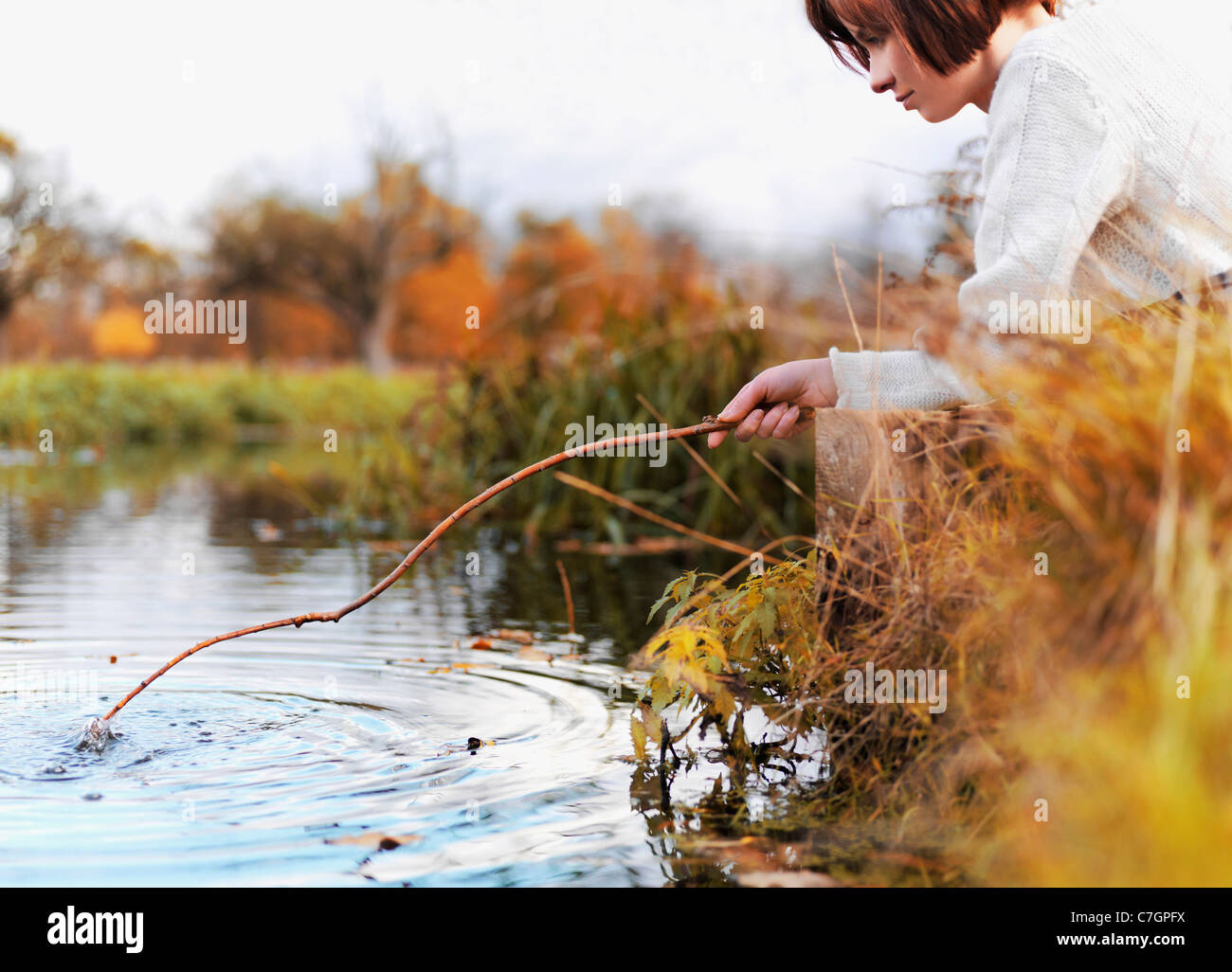 Side view young woman poking hi-res stock photography and images - Alamy