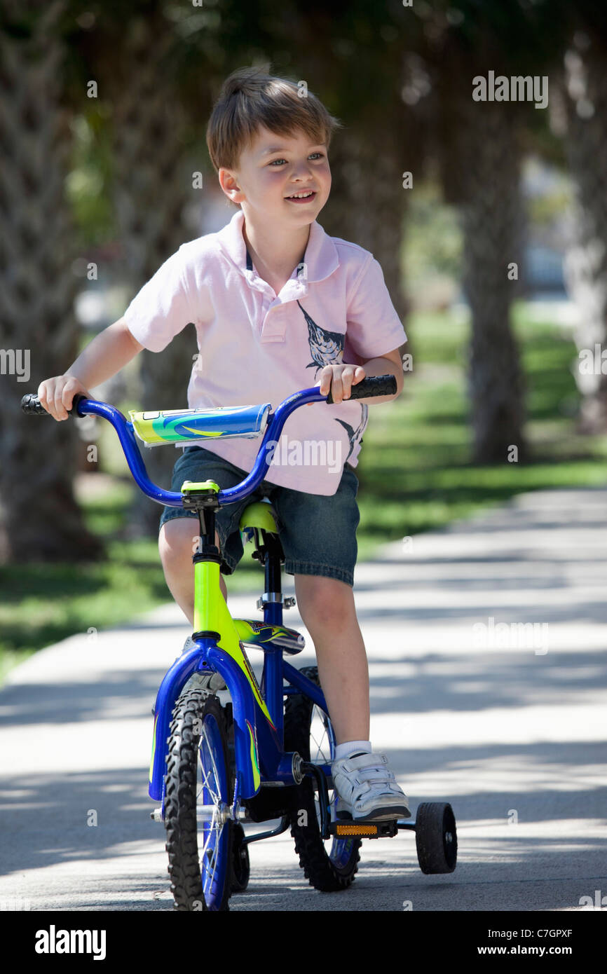 A boy riding a bike Stock Photo - Alamy