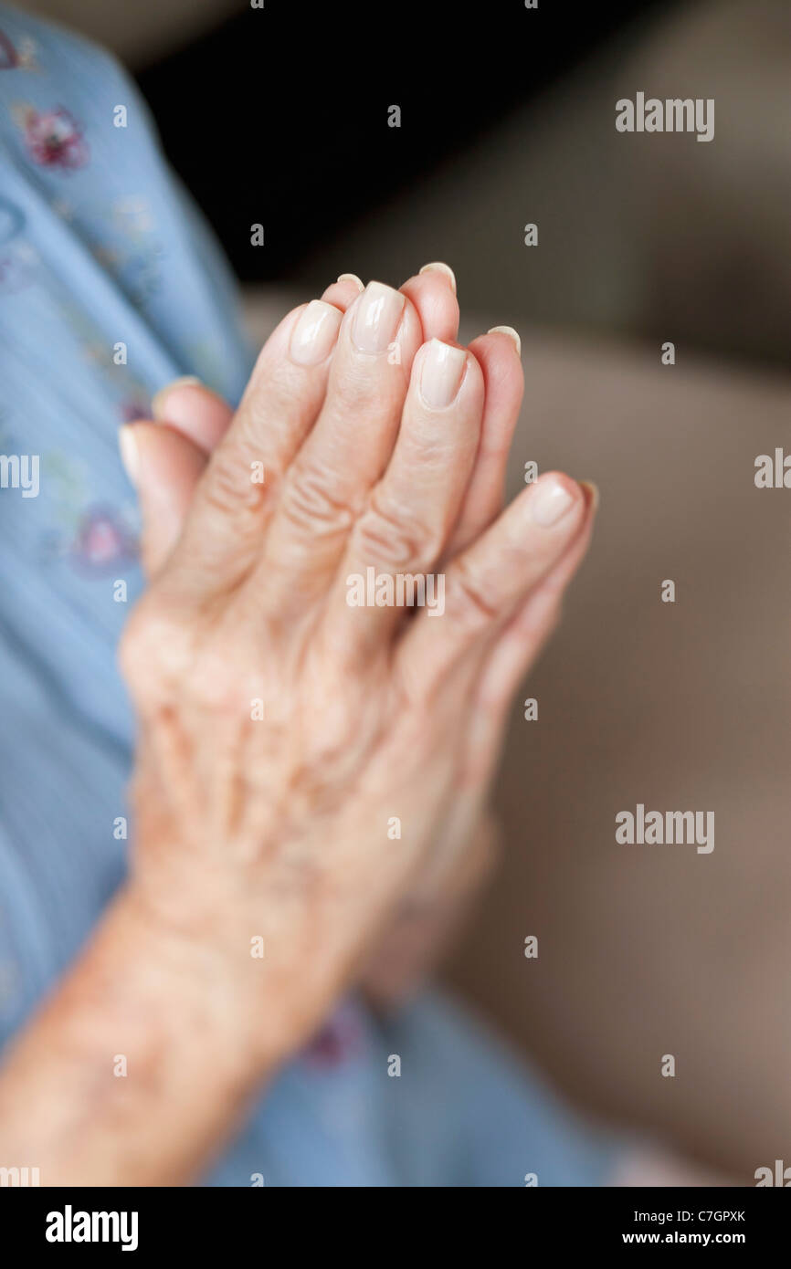Detail of a senior woman praying Stock Photo - Alamy