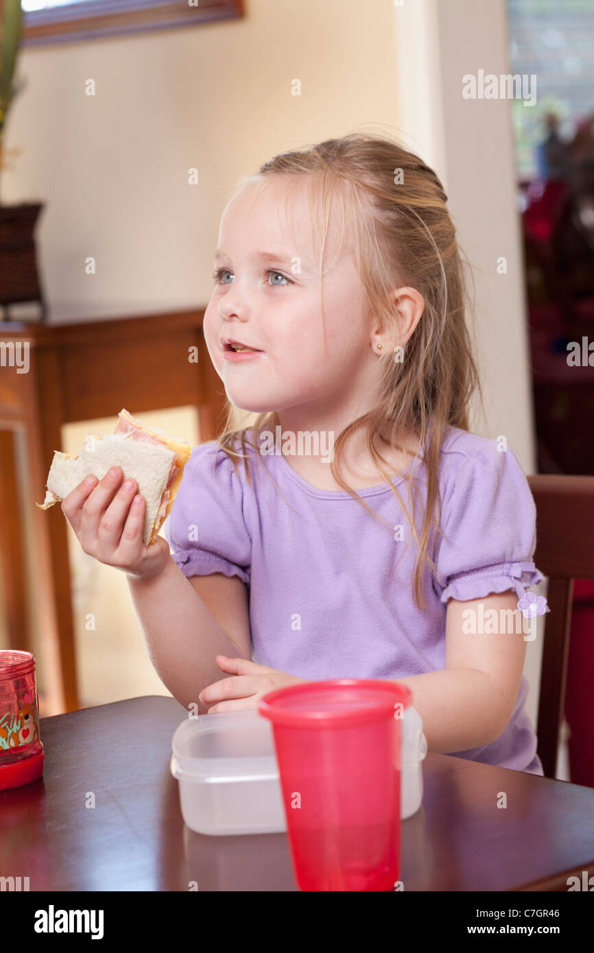Children eating under table hi-res stock photography and images - Alamy