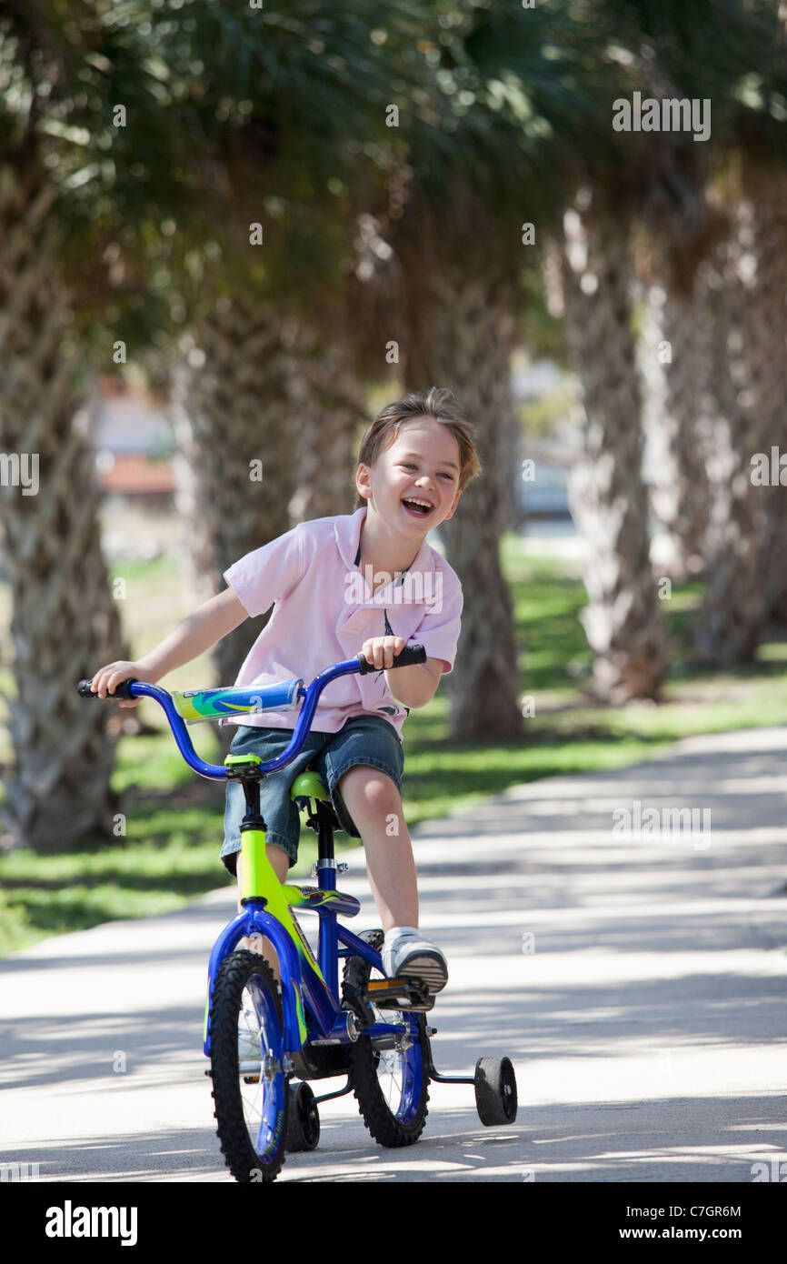 A boy riding a bike Stock Photo - Alamy