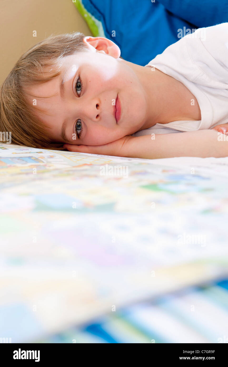 Close-up of a boy lying down Stock Photo - Alamy