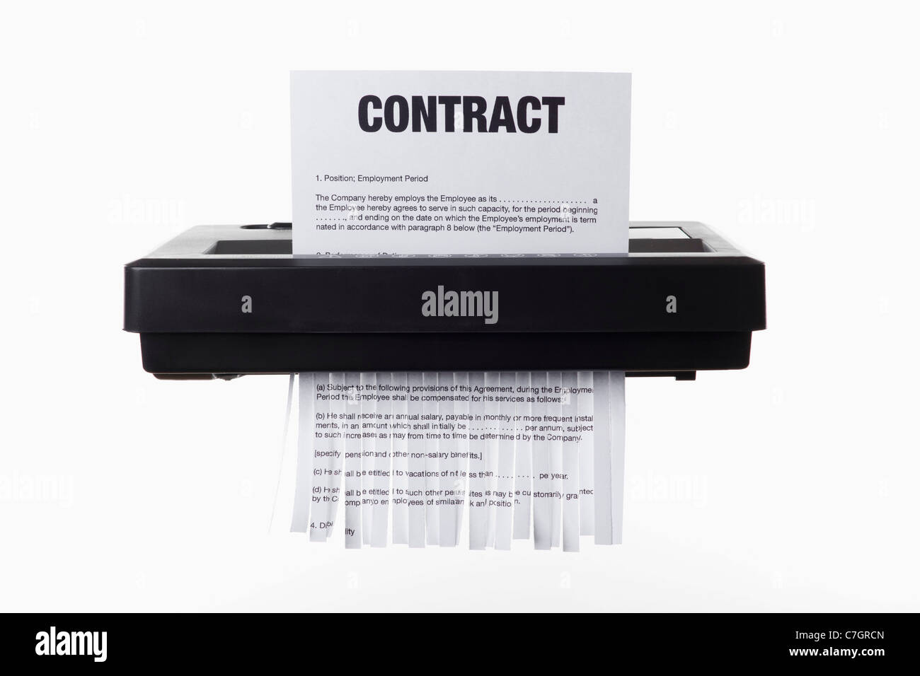 An employment contract being shredded in a paper shredder Stock Photo ...