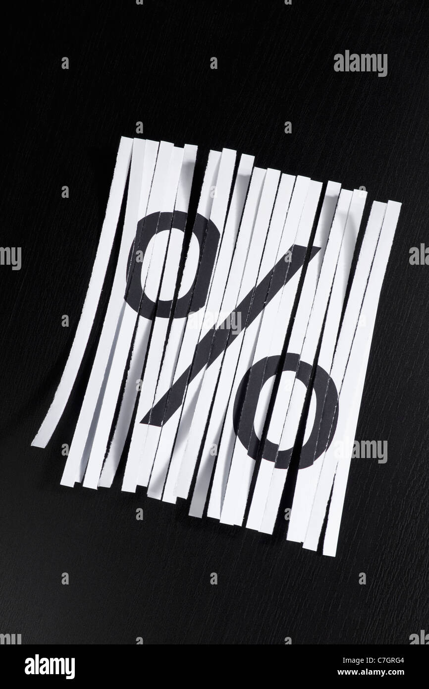 A shredded document with a percentage sign on it Stock Photo - Alamy