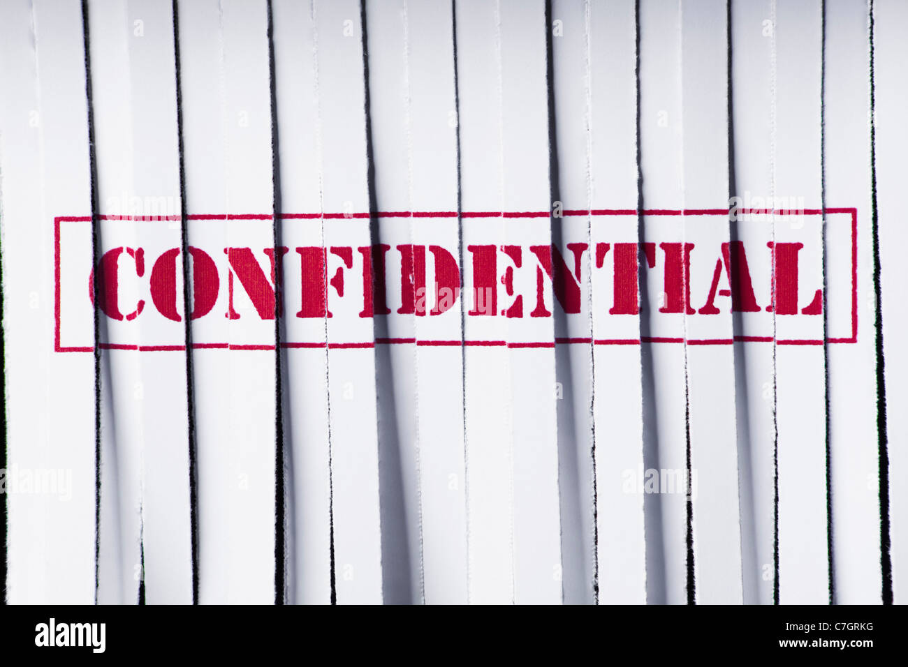 A shredded document with CONFIDENTIAL on it Stock Photo - Alamy