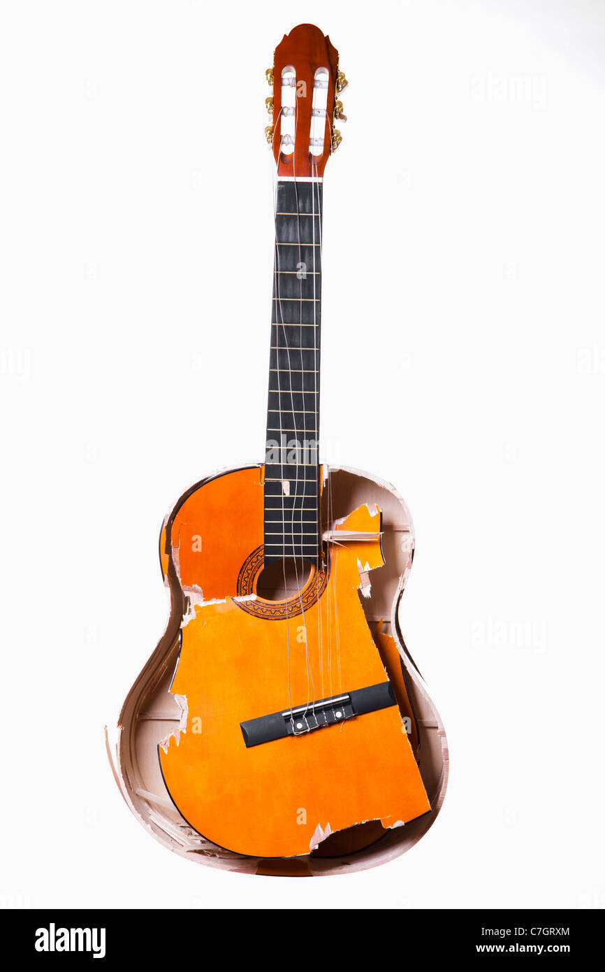 A broken acoustic guitar Stock Photo - Alamy