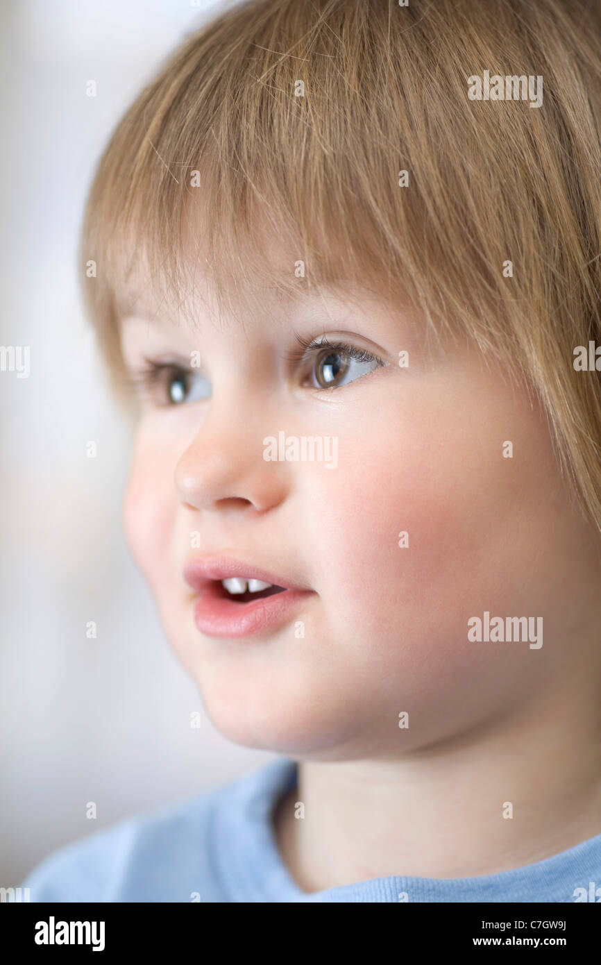 A young boy looking with wonder off camera Stock Photo - Alamy