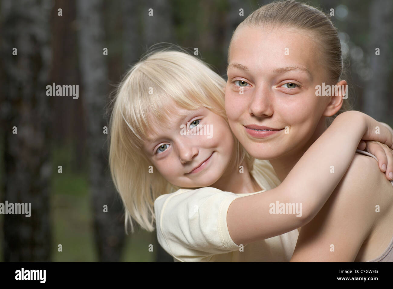 Two sisters embracing hi-res stock photography and images - Alamy