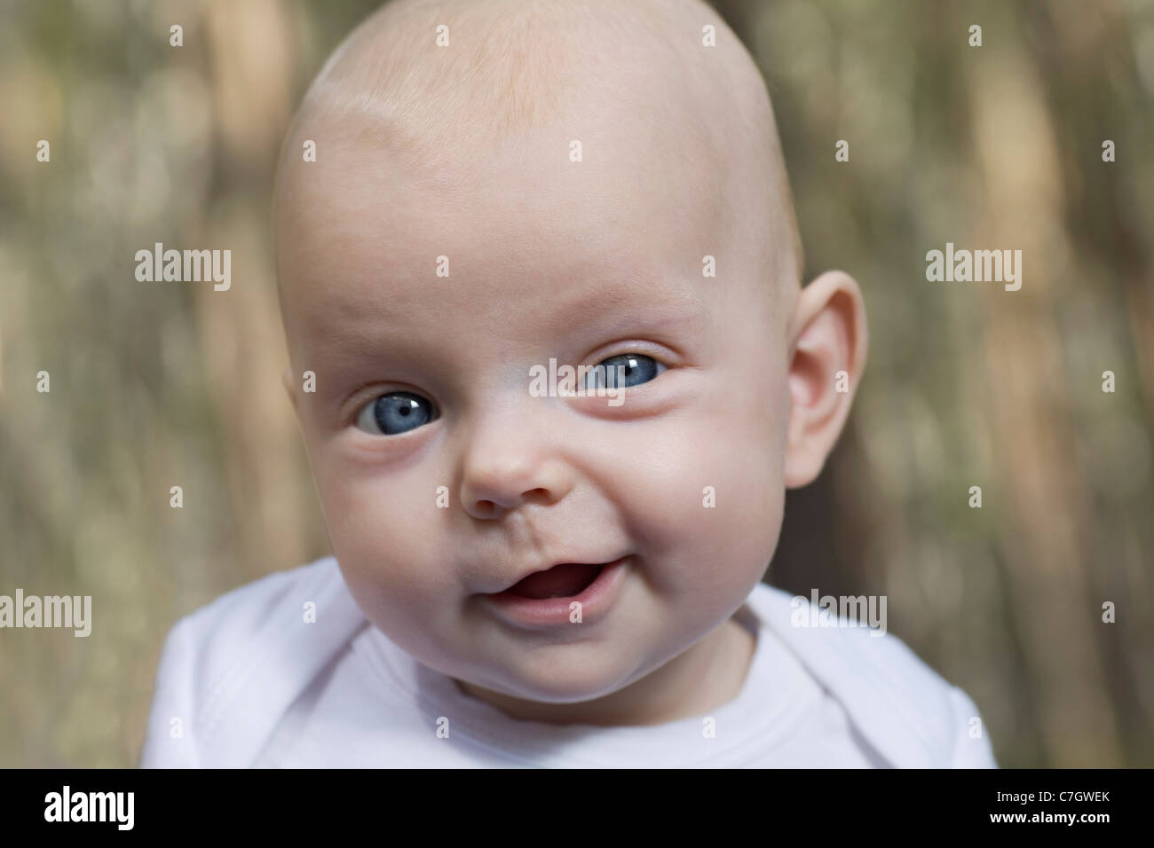 A baby with a funny expression, looking at camera Stock Photo - Alamy