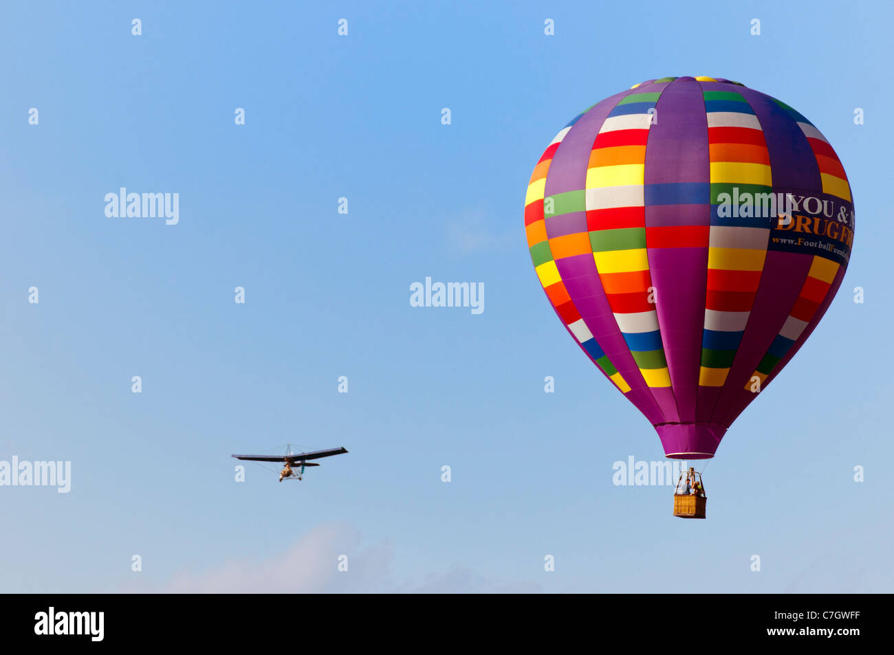 Hot air balloon and ultralight plane sharing air space Stock Photo - Alamy