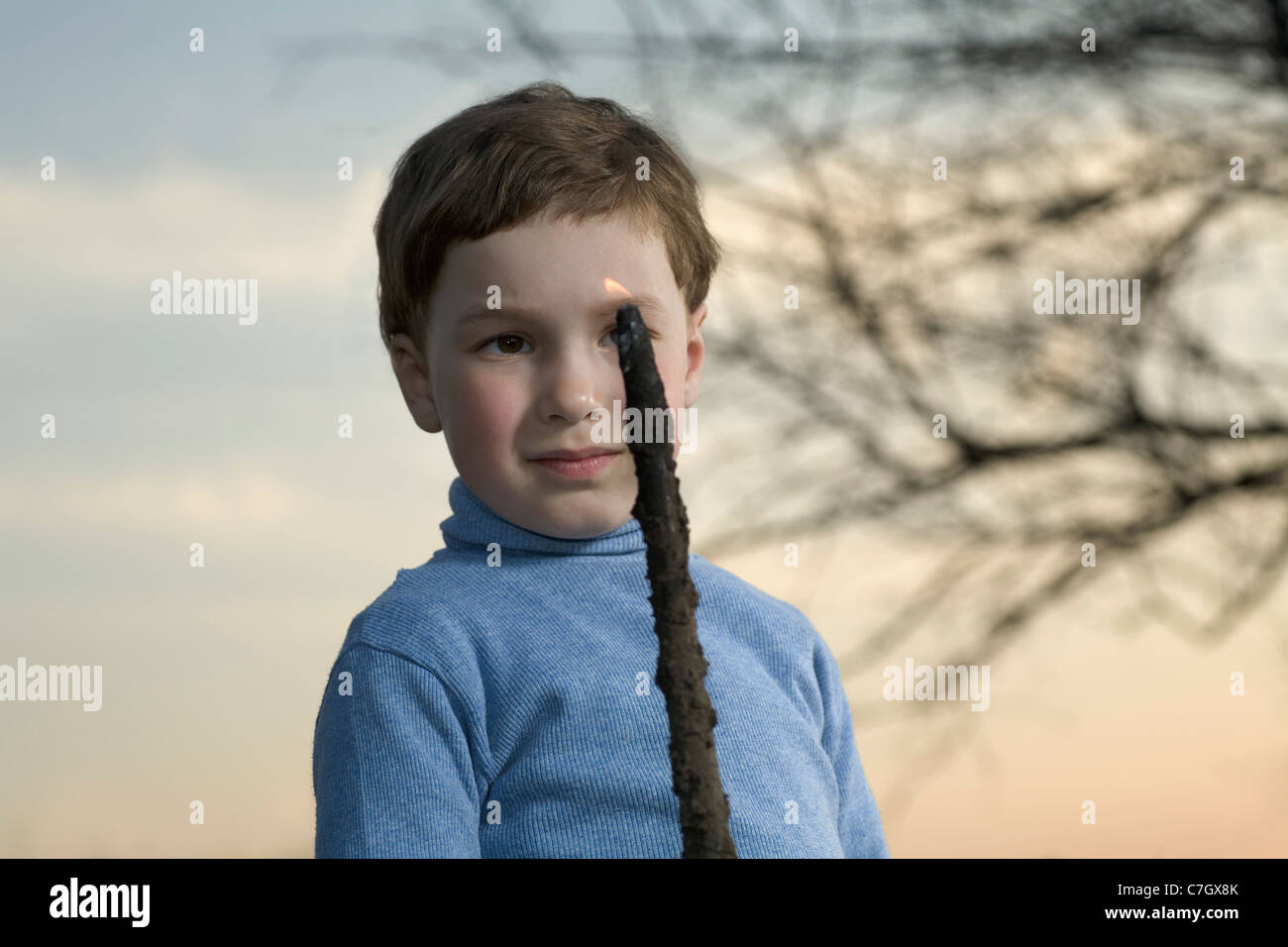 Boy holding a stick hi-res stock photography and images - Alamy