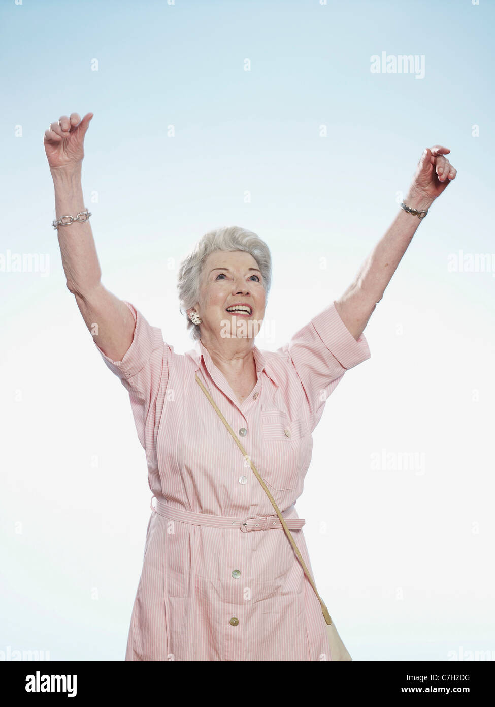 Senior woman cheering Stock Photo - Alamy