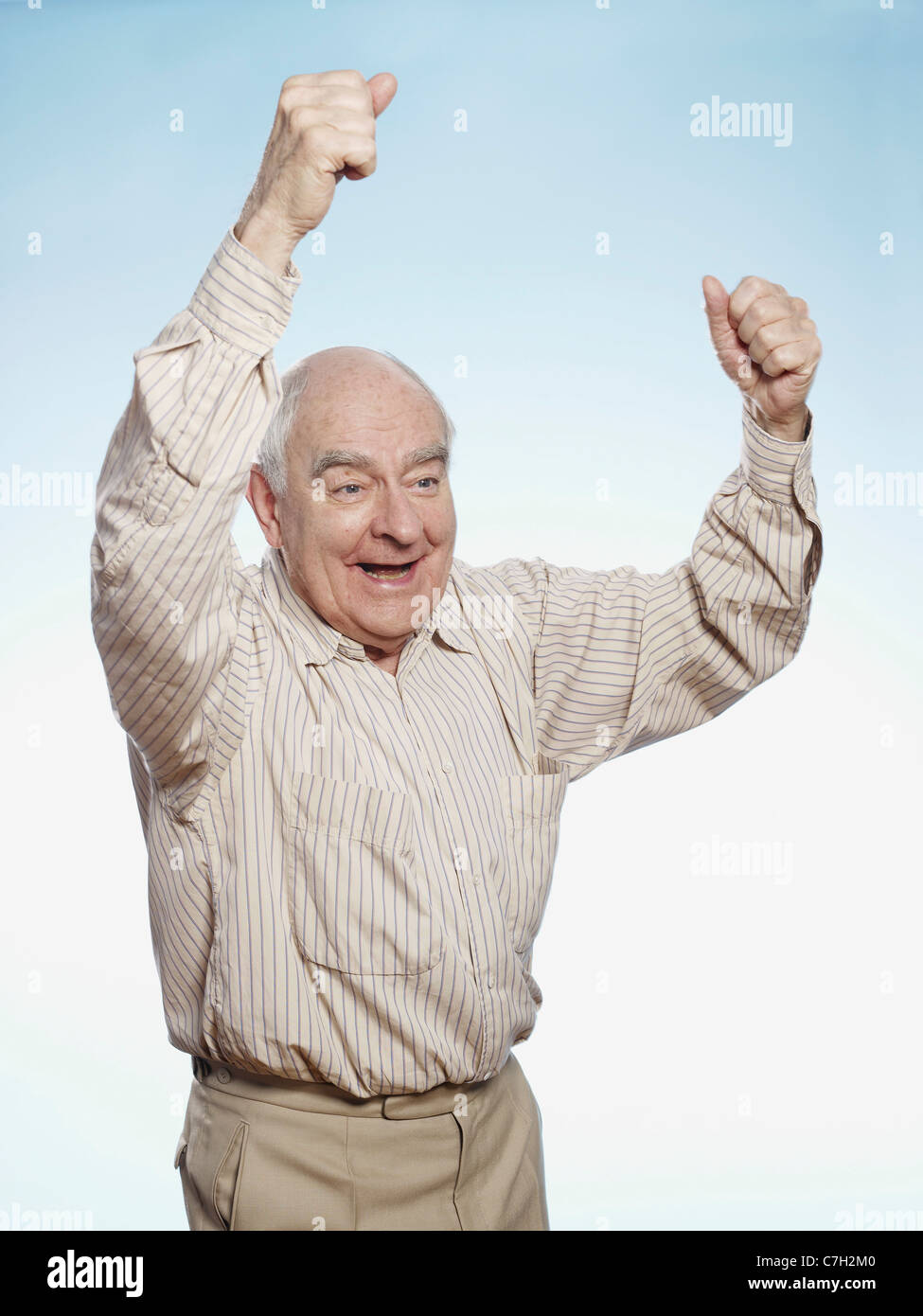 Senior man cheering Stock Photo - Alamy