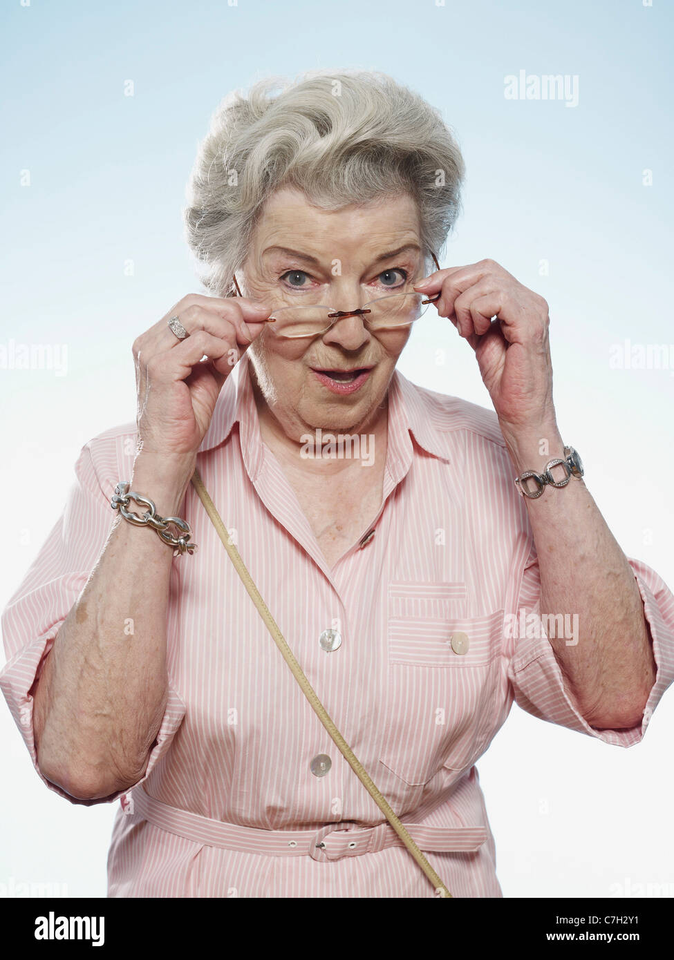 Glasses peering over hi-res stock photography and images - Alamy