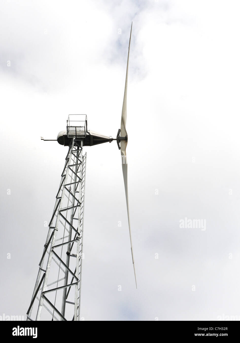 A cut-out of a wind turbine against a cloudy sky Stock Photo - Alamy