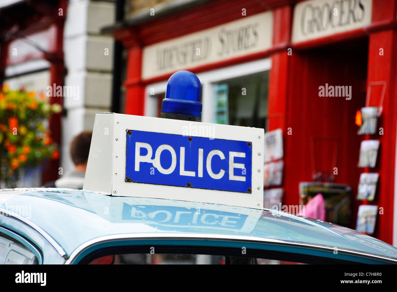 Top of Ford Anglia police car with Aidensfield stores in the background ...