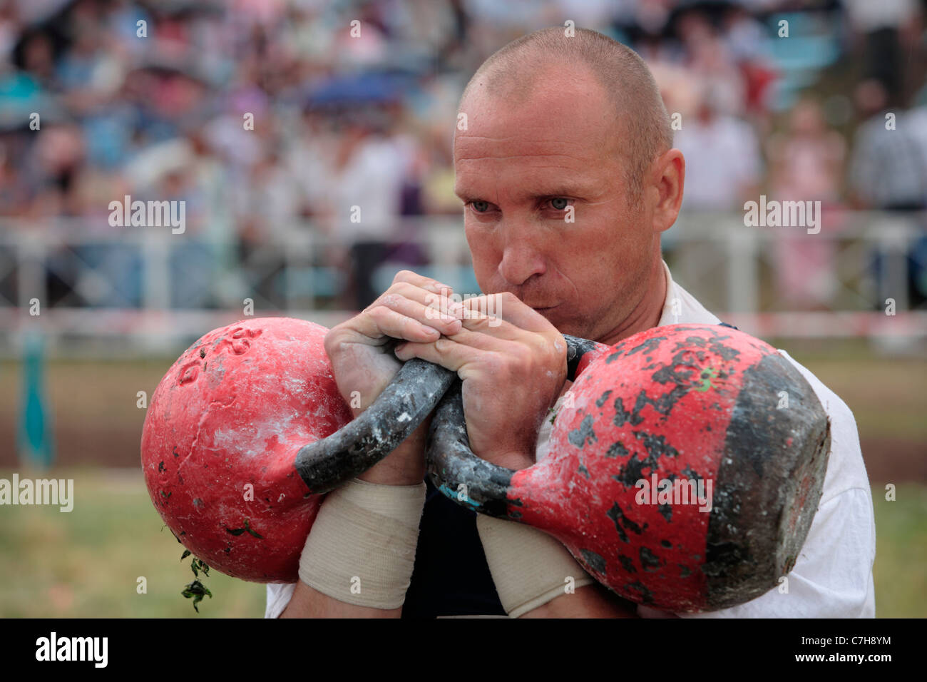 The Tatar folk holiday Sabantuy. Competition on a raising of weights ...