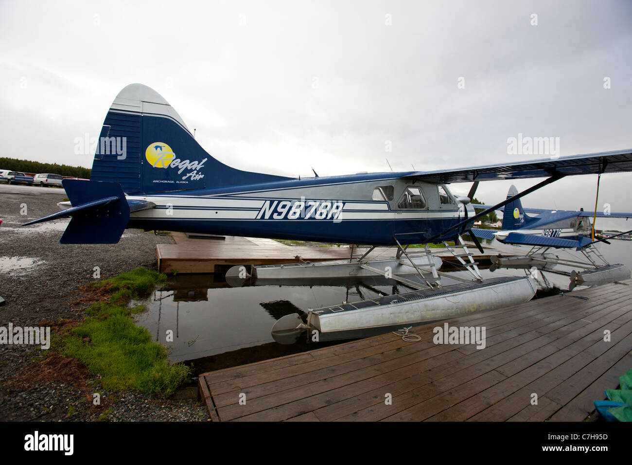 Float plane sits by a dock at Lake Hood, Anchorage, Alaska, United ...