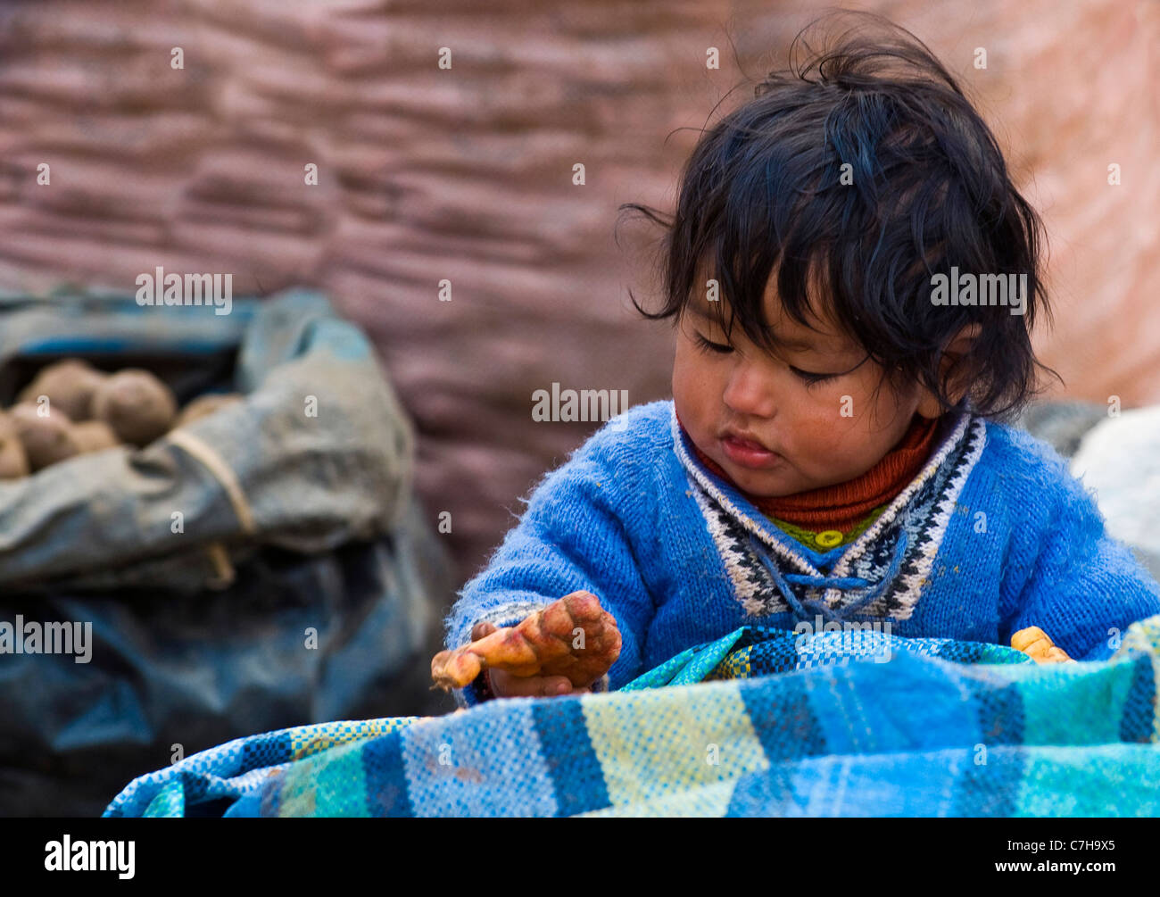 Peruvian child in a local market Stock Photo - Alamy