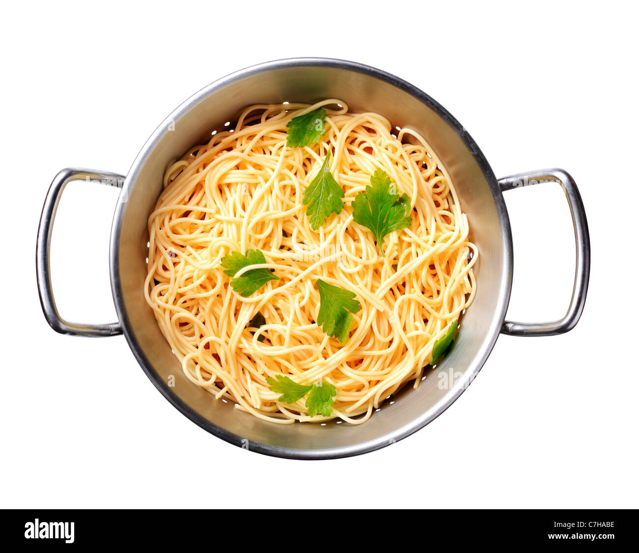 Cooked spaghetti in a colander - cut out on white Stock Photo - Alamy