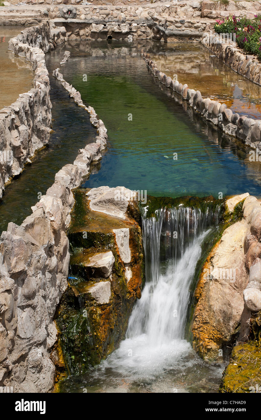 Steam rises of the hot waters at the Banos del Incas outside of the ...
