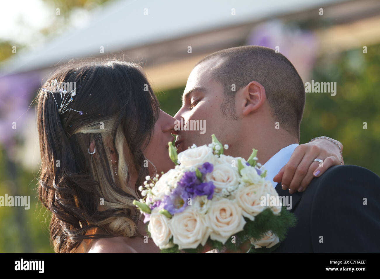 bride and groom kissing Stock Photo - Alamy