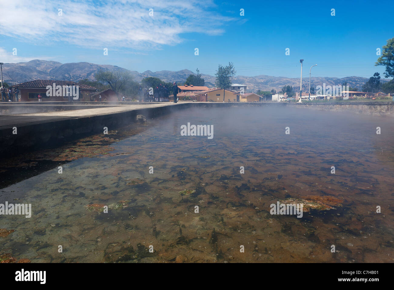 Steam rises of the hot waters at the Banos del Incas outside of the ...