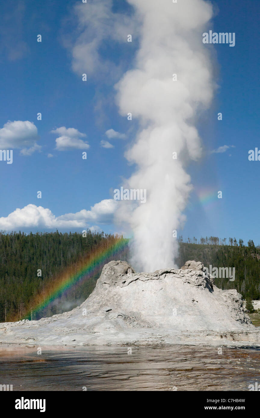 Castle Geyser erupts as a double rainbow forms in its mist in ...